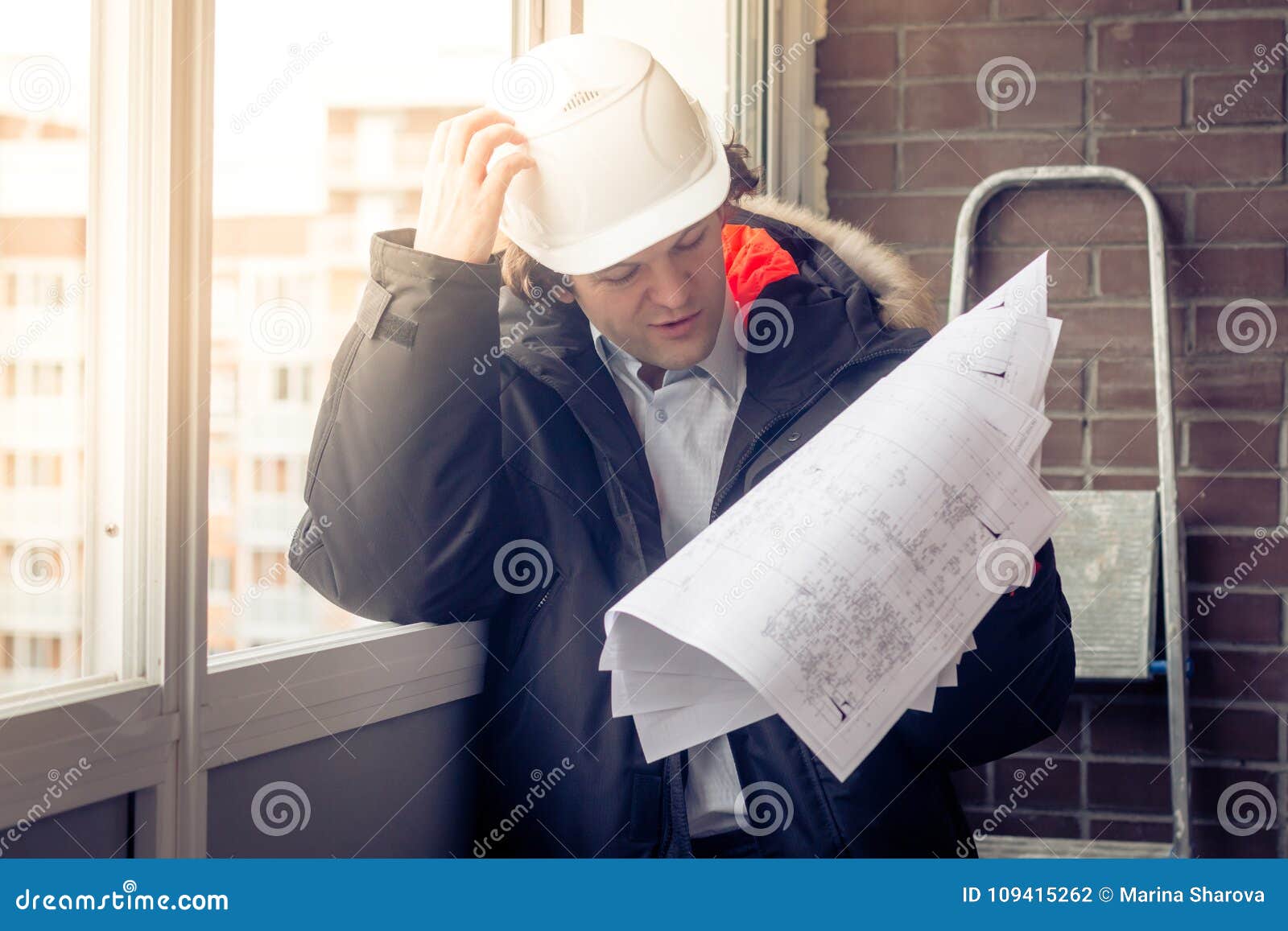 Pensive Young Man Builder in Hard Hat Standng and Thinking. Soft Focus ...