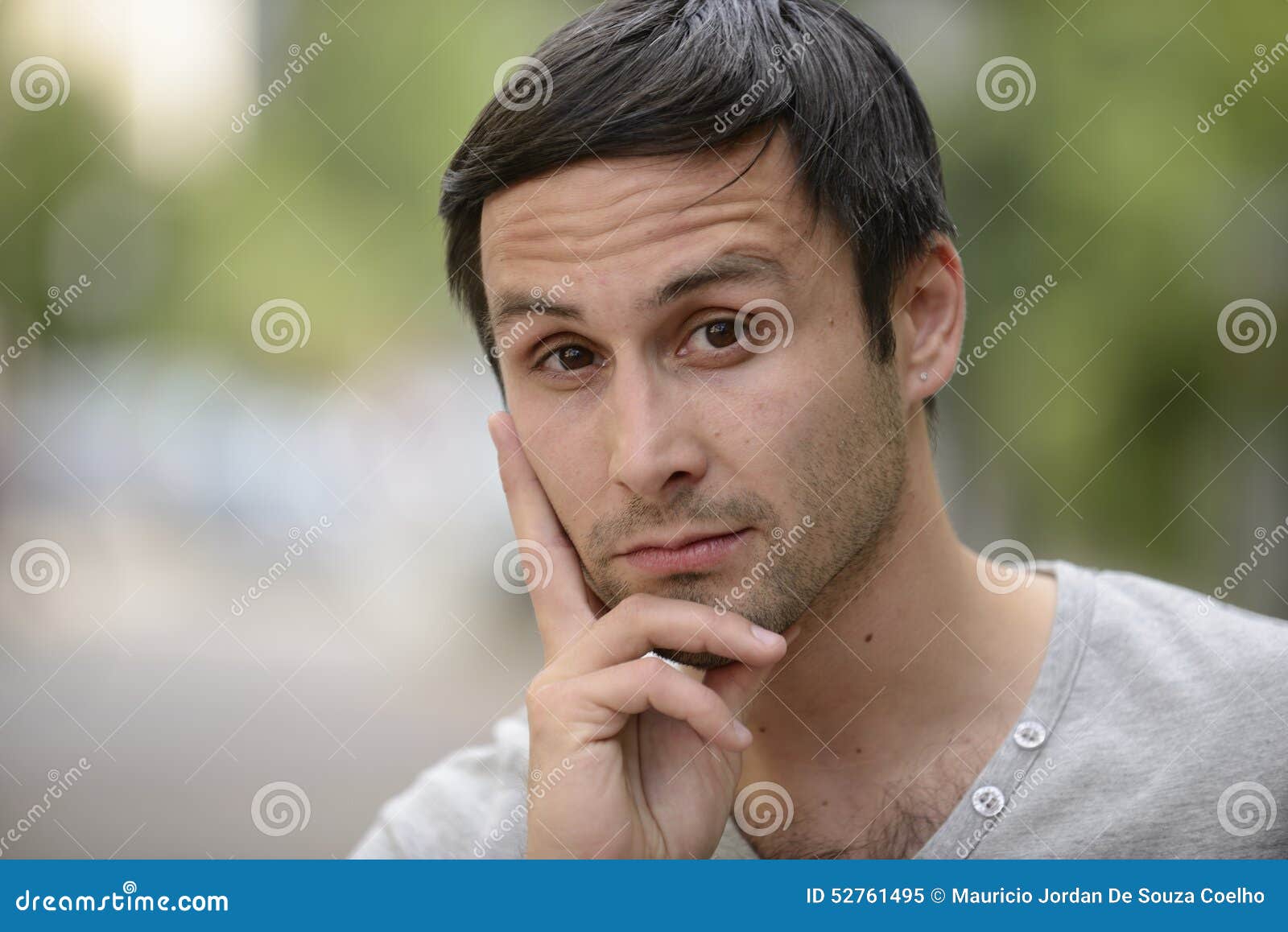 Pensive young man outdoors stock image. Image of business - 52761495