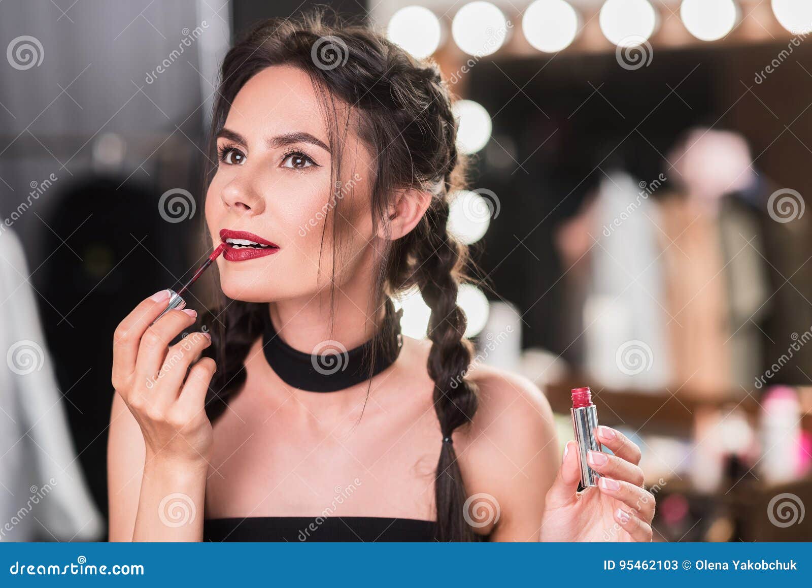 Pensive Young Woman Applying Lip Gloss Stock Image Image Of Backstage