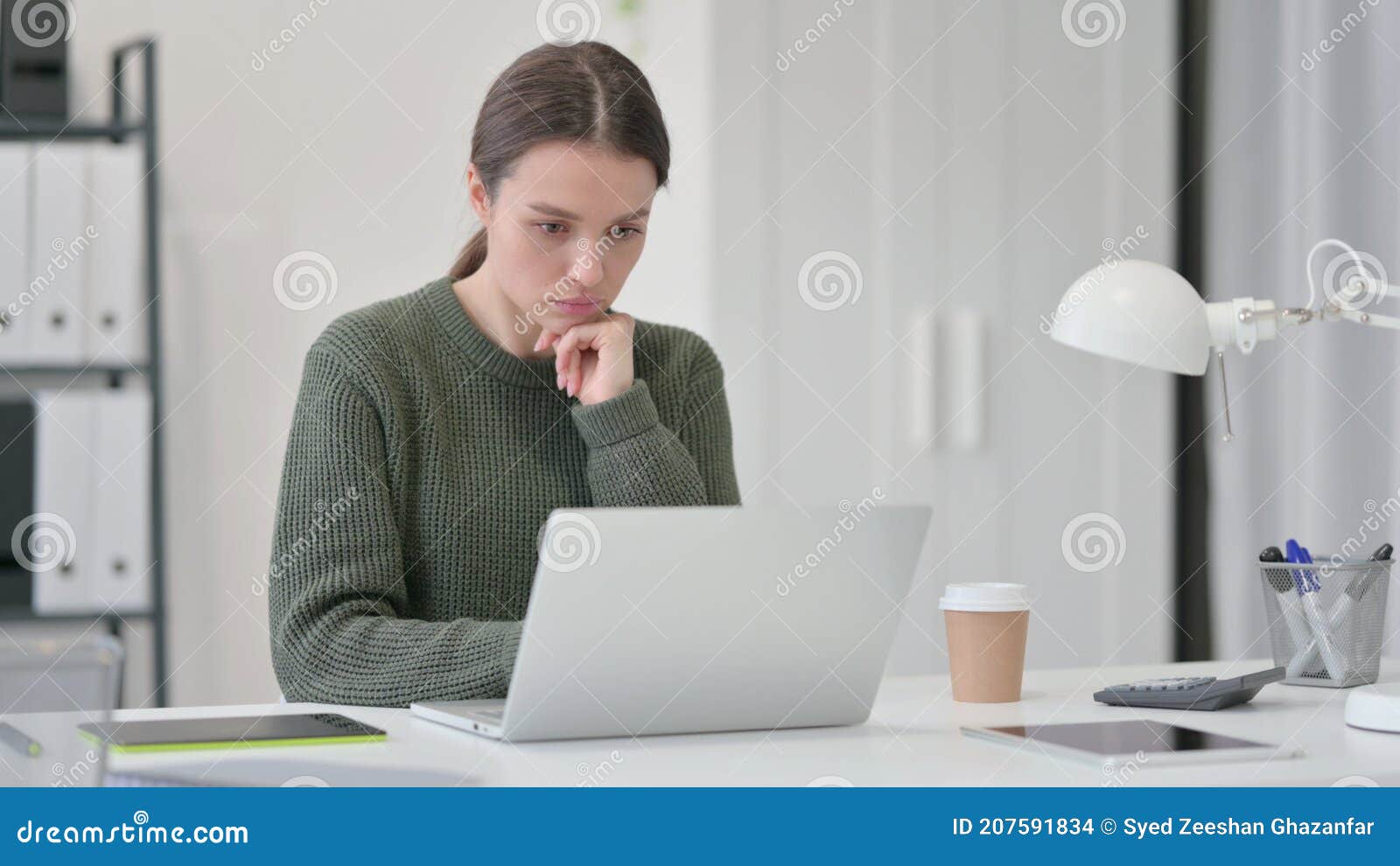 Pensive Young Woman Reading on Laptop Stock Photo - Image of working ...
