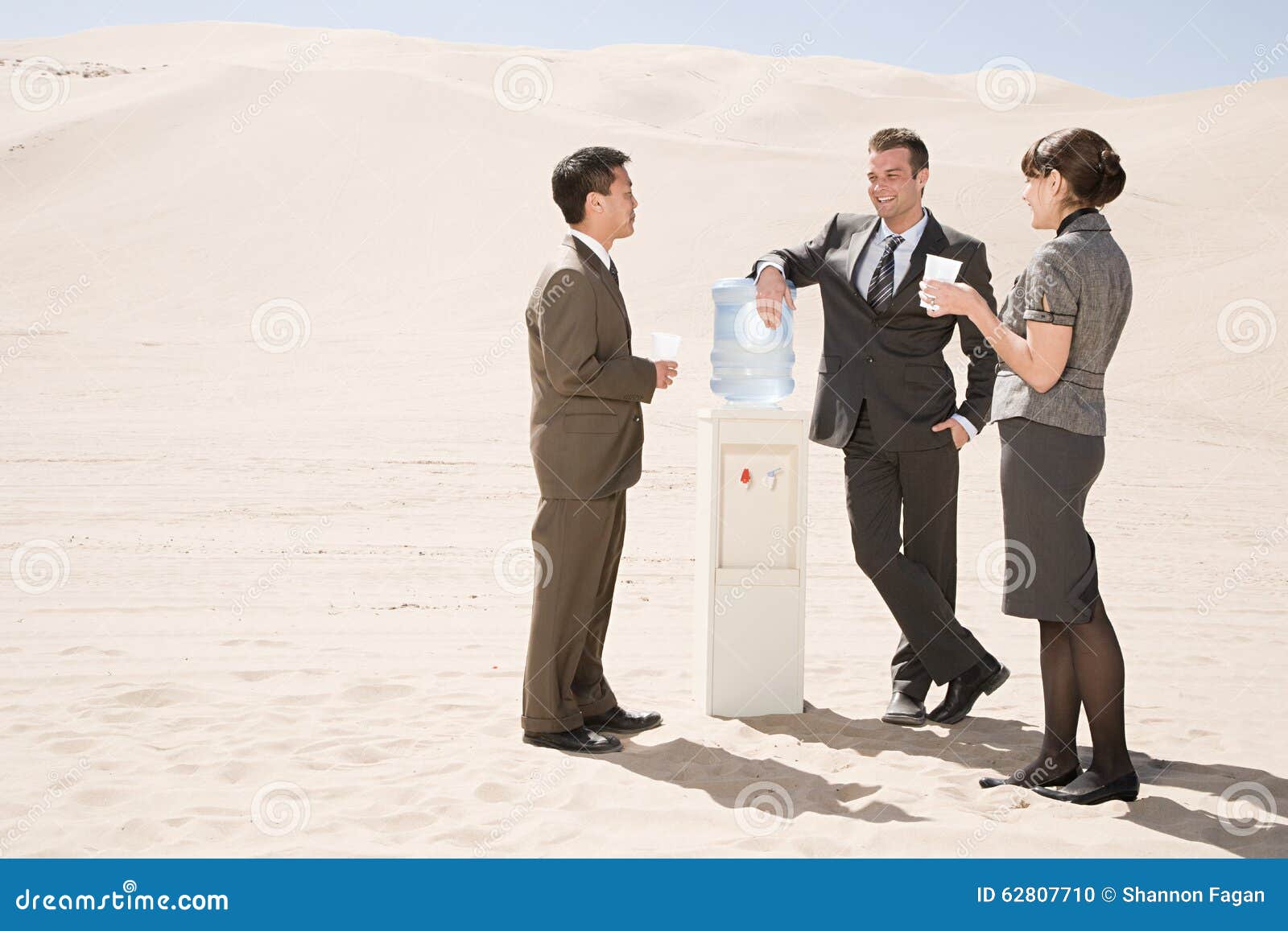 People Around Water Cooler in the Desert Stock Photo - Image of ...