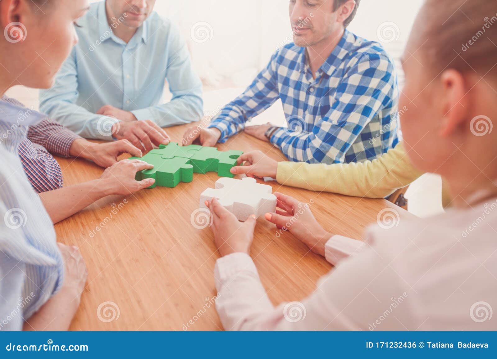 People Assembling Jigsaw Puzzle Stock Photo - Image of jigsaw ...