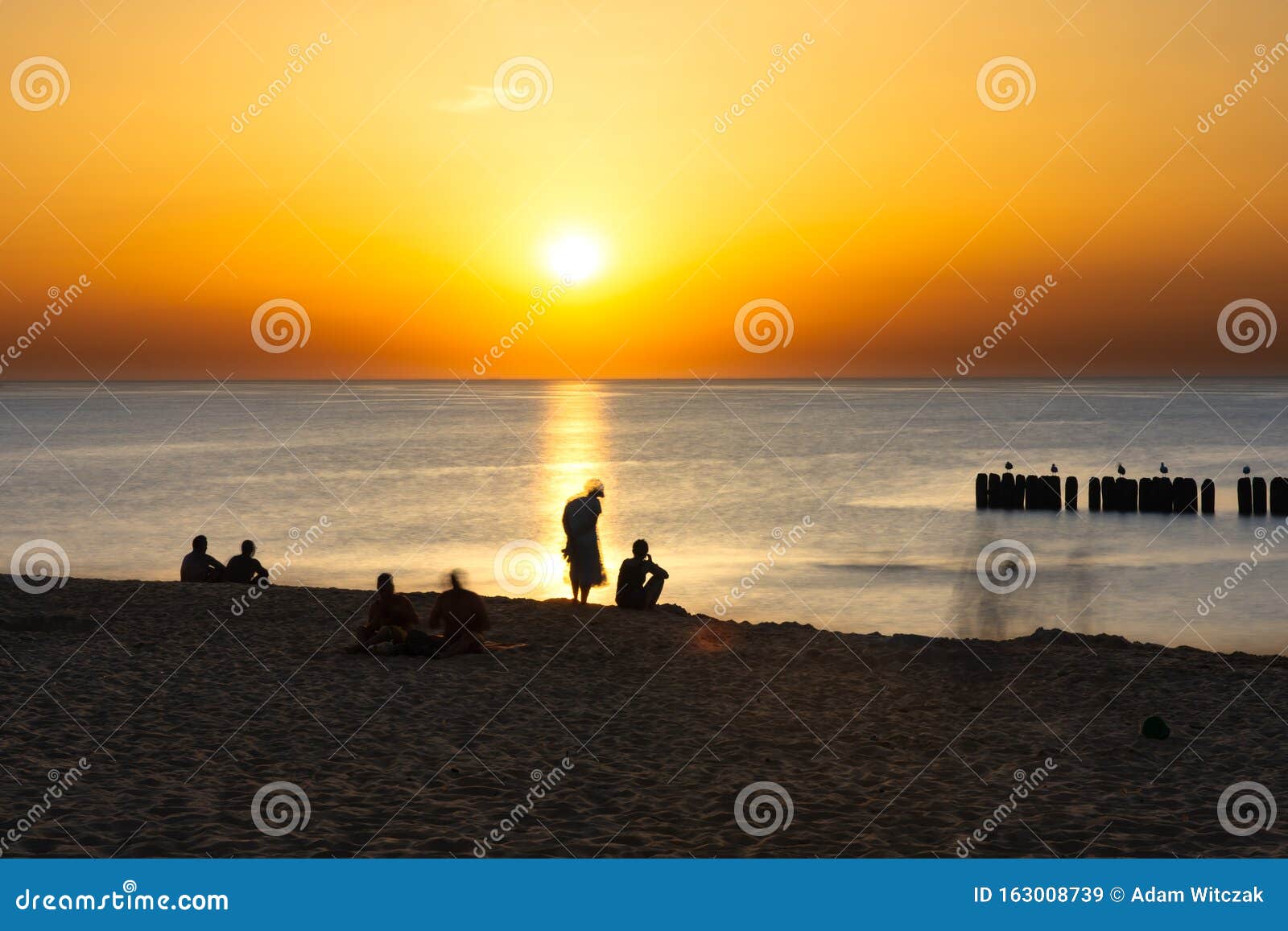 People on the Beach during a Beautiful Sunset Stock Image - Image of ...