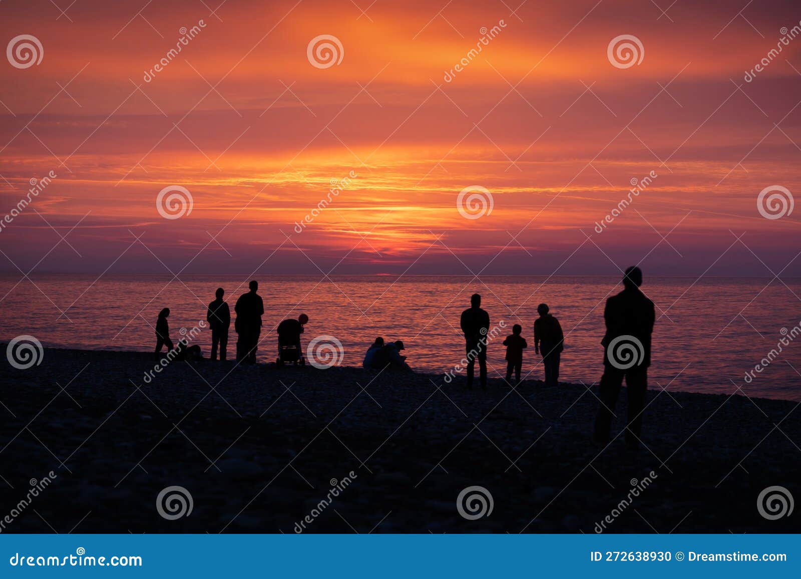 People on a Beach Watching Sunset Stock Photo - Image of beach, sand ...