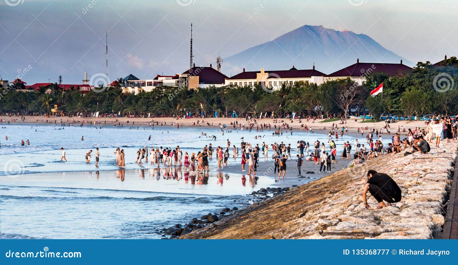 People on the Beach in Kuta Bali with Mt. Agung in the Background ...