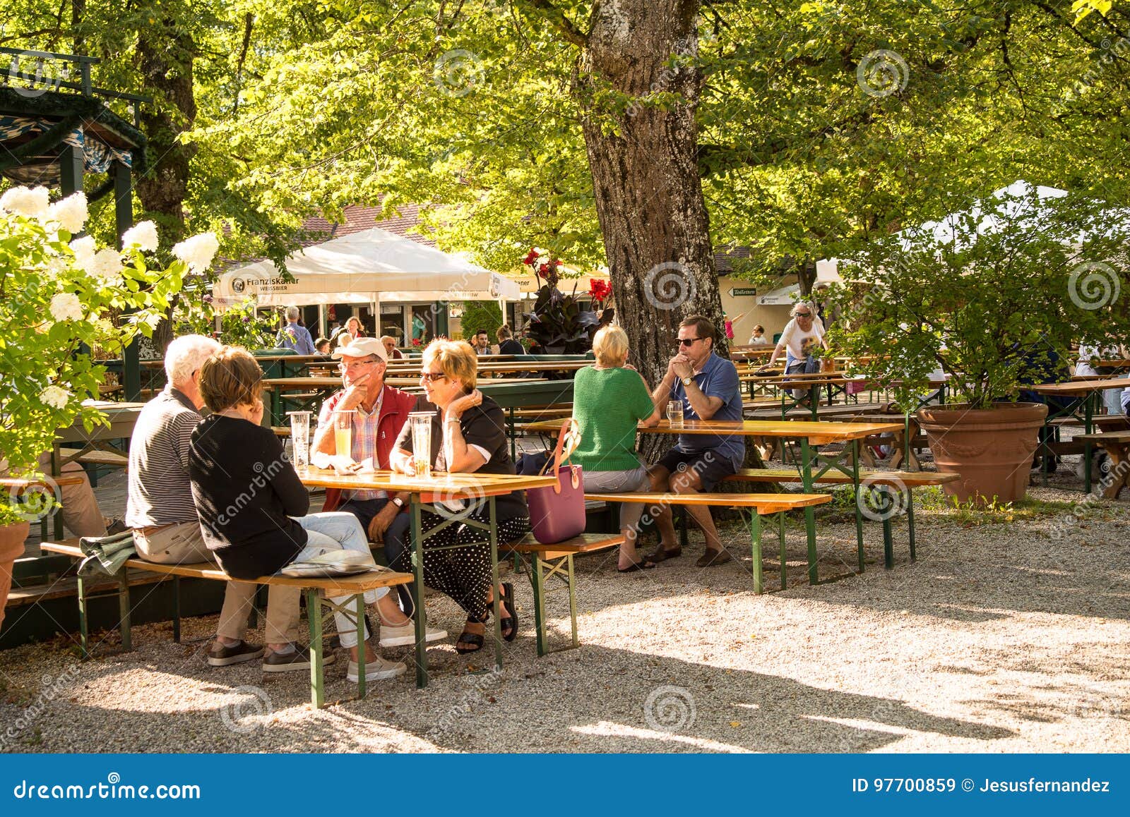 People in a biergarten editorial stock image. Image of lifestyles ...