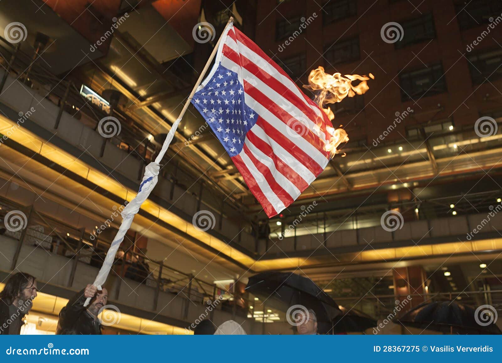 People burn a U.S. flag editorial image. Image of finance - 28367275