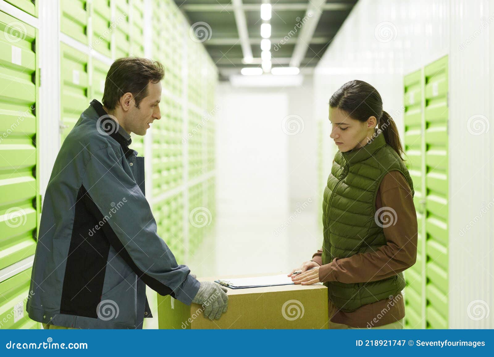 People carrying boxes stock image. Image of holding - 218921747