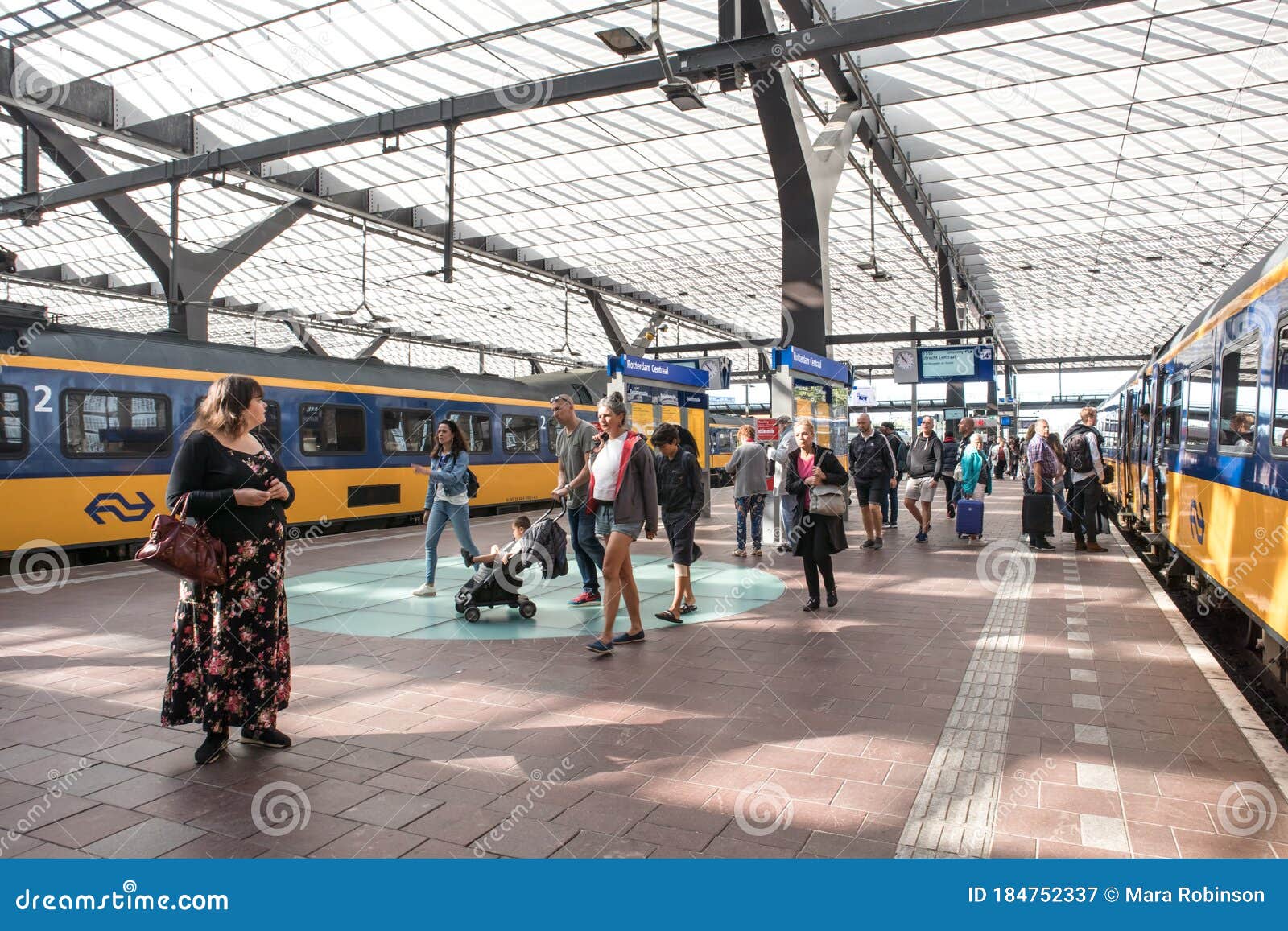 People on a Central Platform of a Railway Station with Trains on Either ...