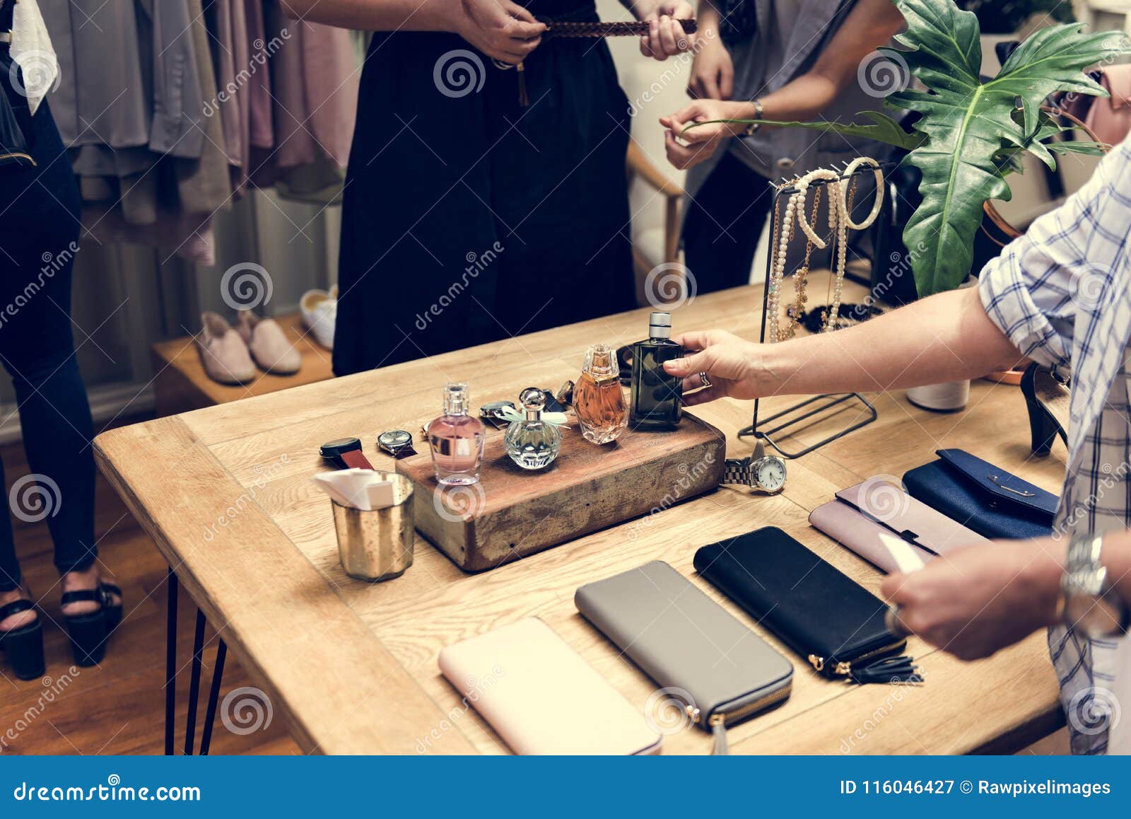 People Checking Out Clothes and Perfume Stock Image - Image of ...