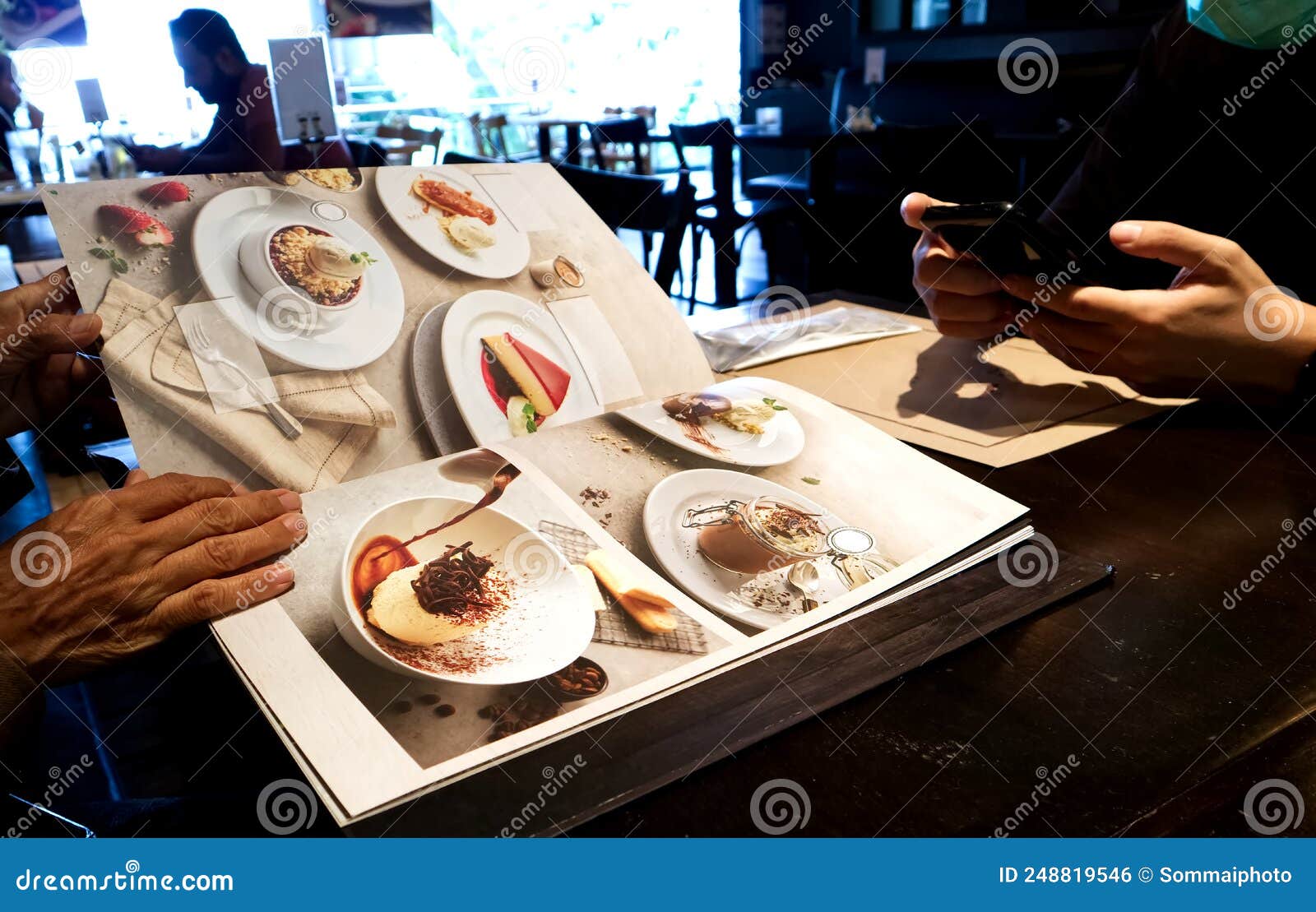 People Choosing Food from a Menu Item in a Restaurant at True Digital ... People Choosing Food from a Menu Item in a Restaurant at True Digital ...