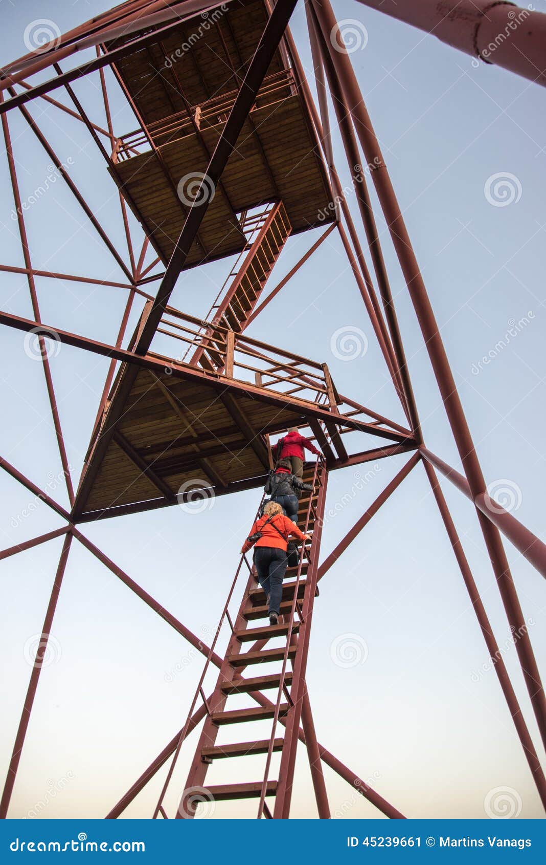 People climbing tower stock image. Image of occupation - 45239661