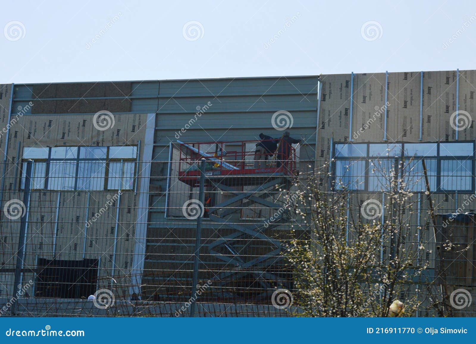 People on Cranes Install Windows on the Factory Stock Photo - Image of ...
