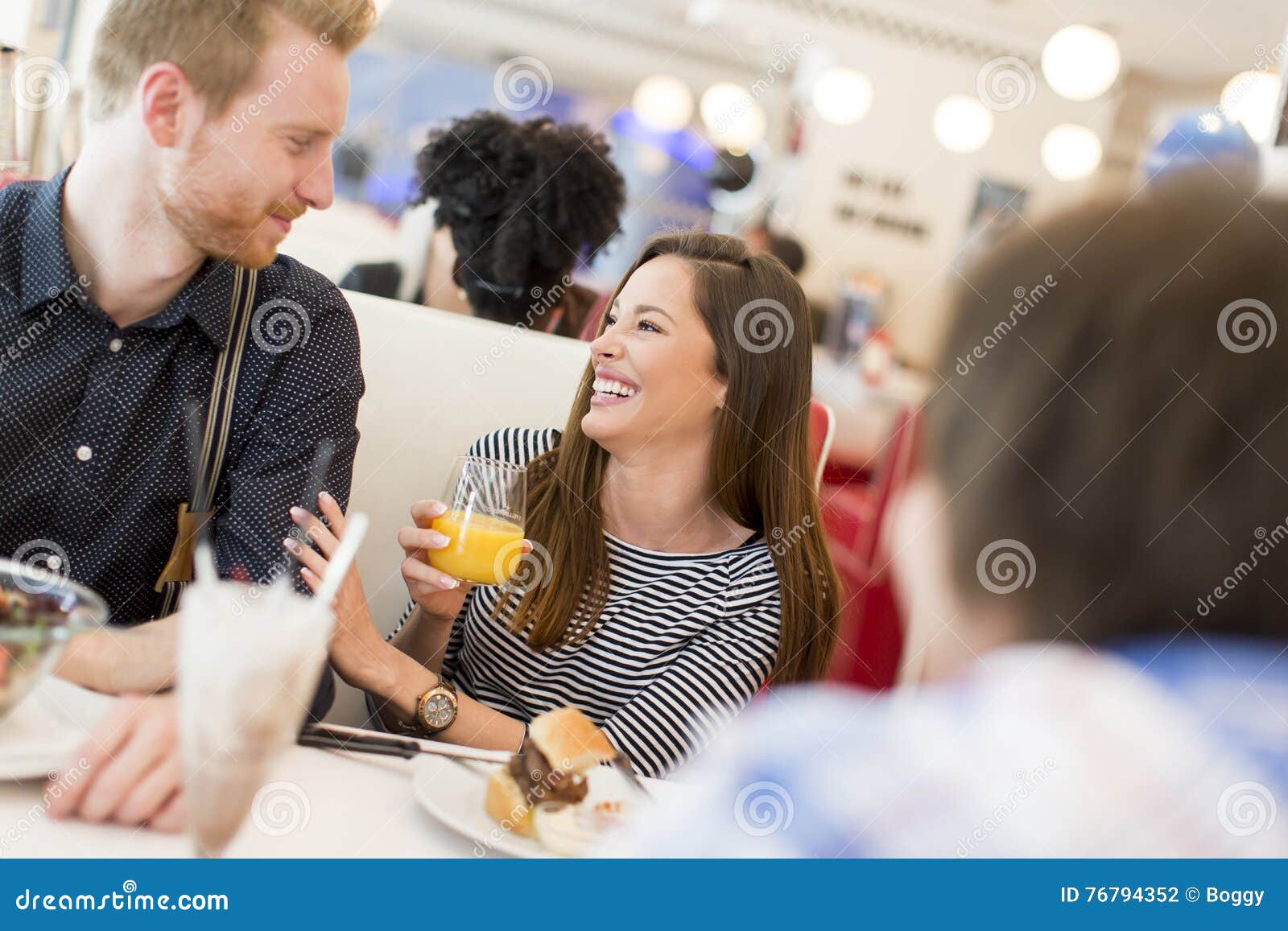 People in diner stock photo. Image of meal, burger, people - 76794352
