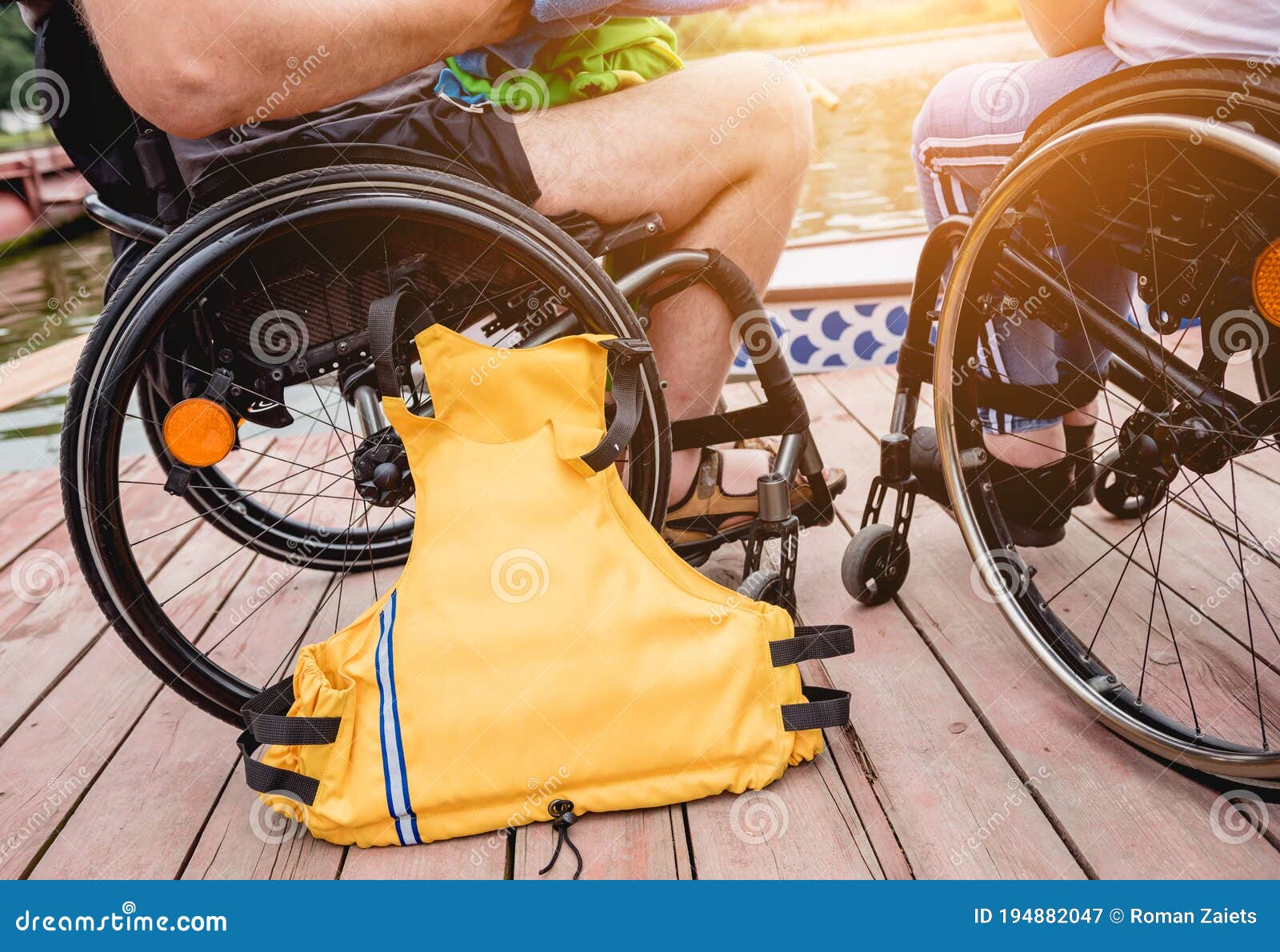 People with Disabilities in Life Vests on the Pier. Stock Image - Image ...