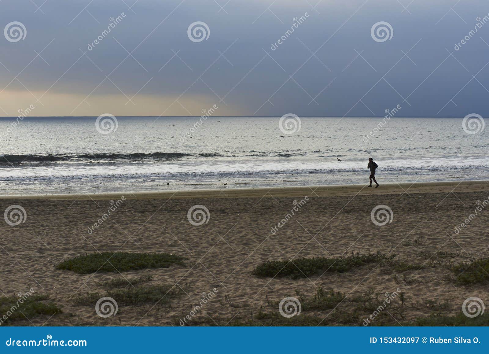 People Doing Sports at the Shore of the Beach in a Sunset Stock Image ...