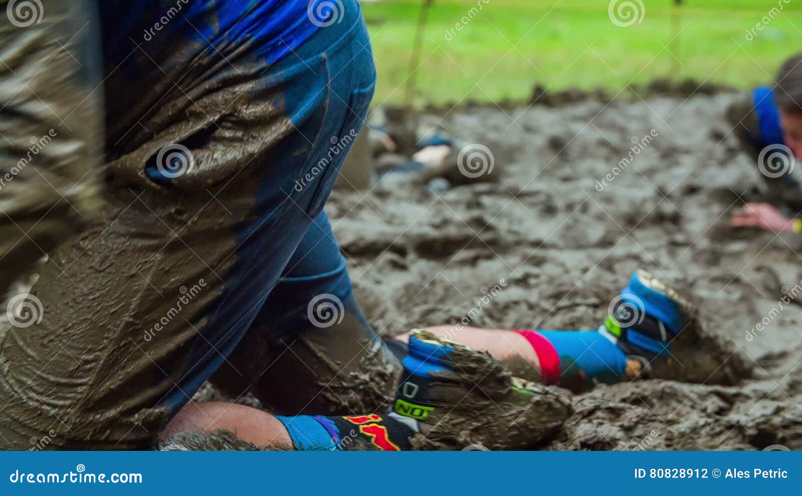 People Dragging through Mud As Part of Obstacle Course Stock Footage ...