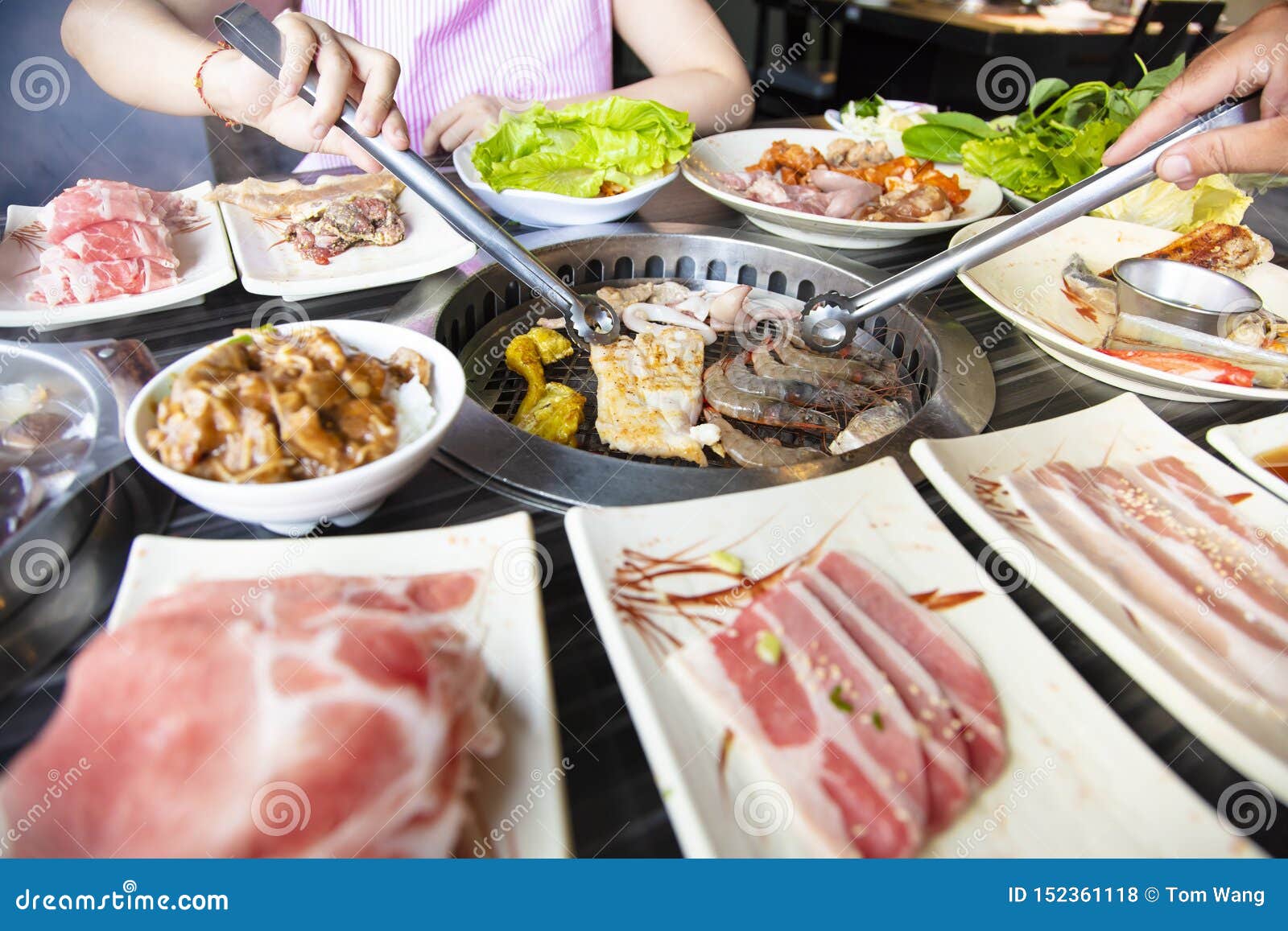 People Eating Barbecue Beef in Restaurant Stock Photo - Image of meat ...