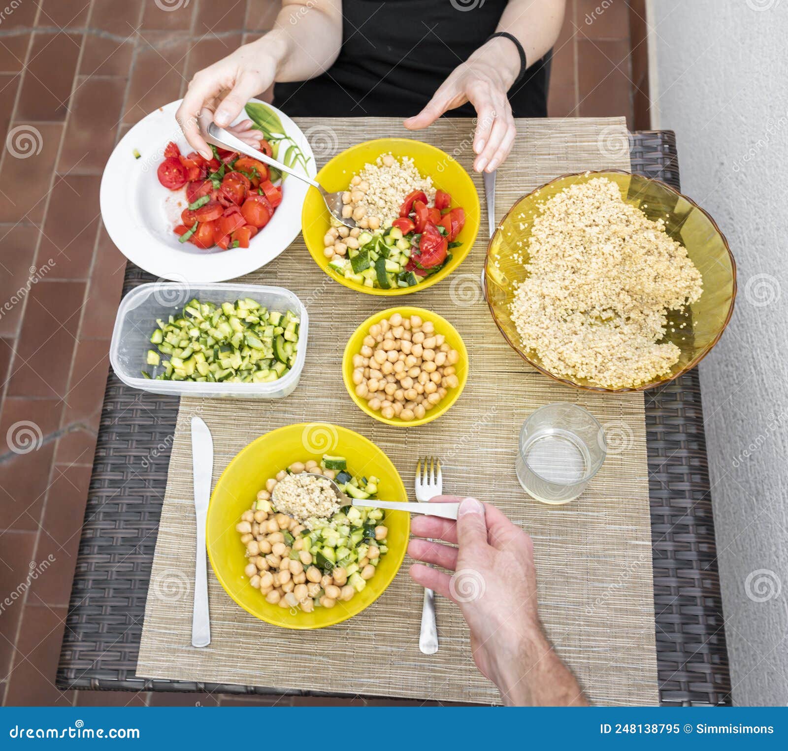 People eating a vegan meal stock image. Image of hand - 248138795