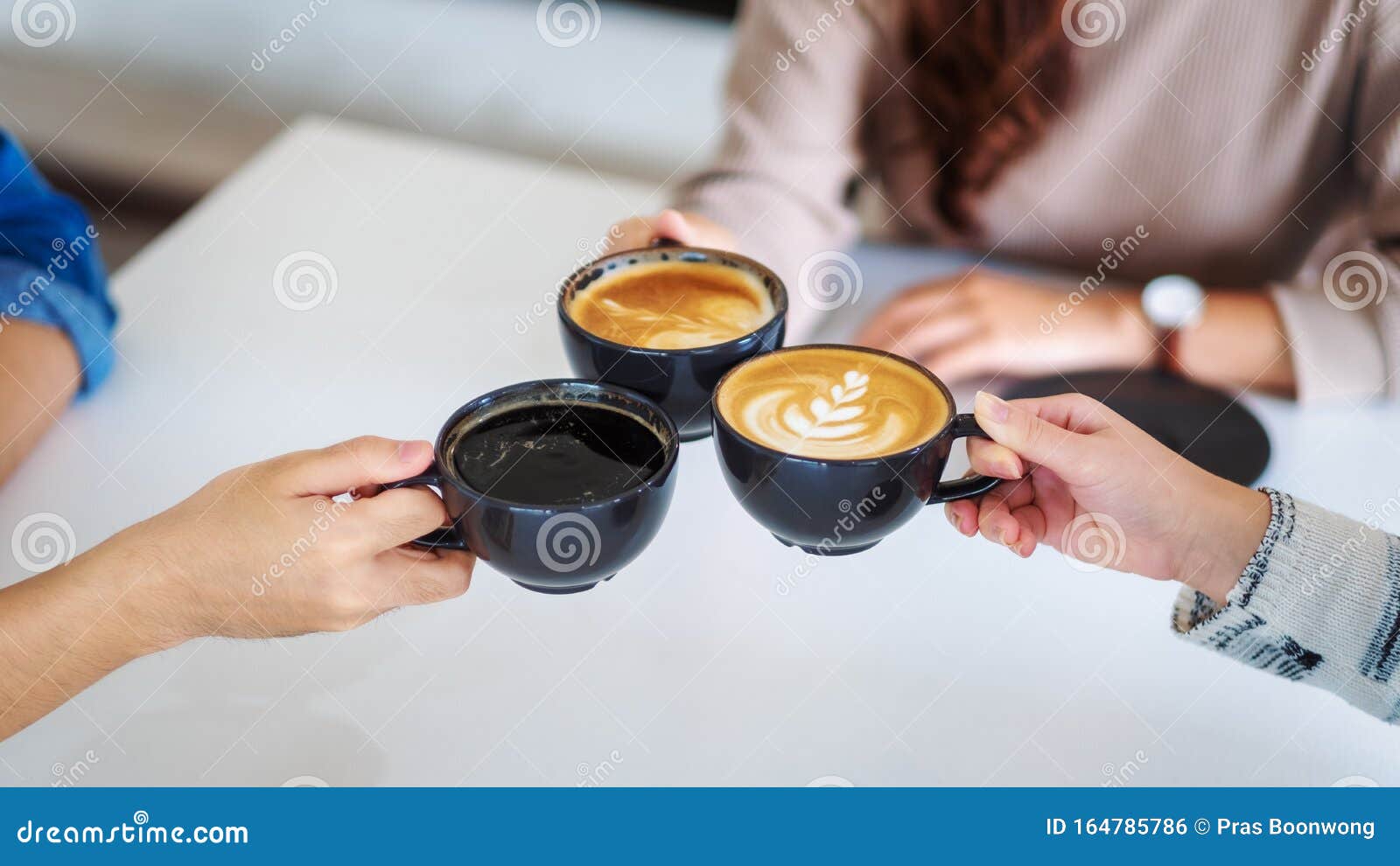 People Enjoyed Drinking and Clinking Coffee Cups Together on the Table ...