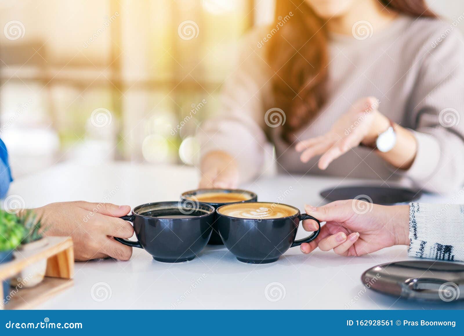 People Enjoyed Talking while Drinking and Clinking Coffee Cups on the ...