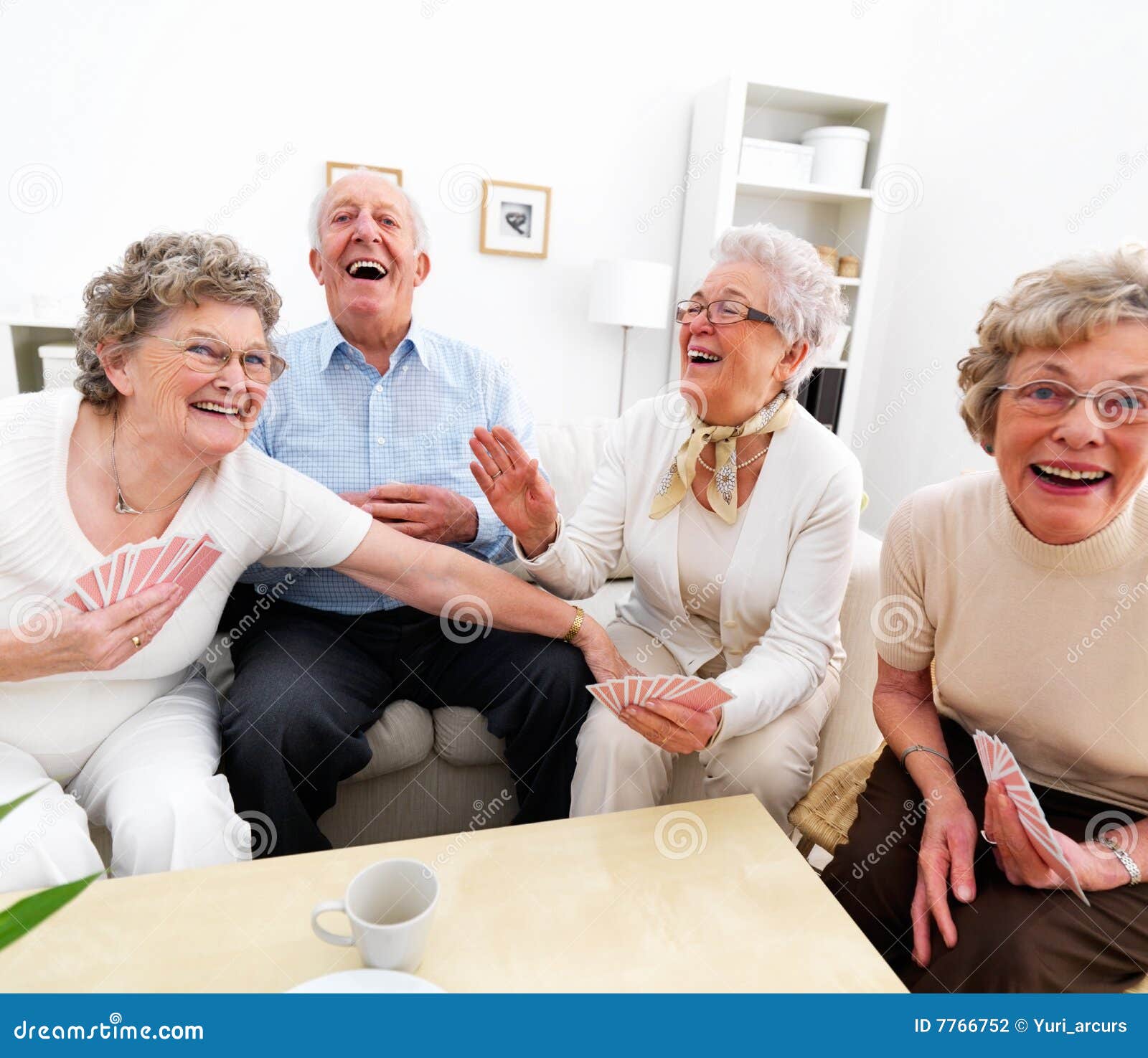 People Enjoying Themselves Over a Card Game Stock Photo - Image of ...