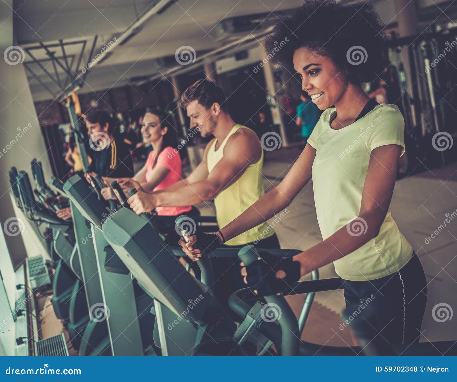 People Exercising on a Cardio Training Machines Stock Photo - Image of ...