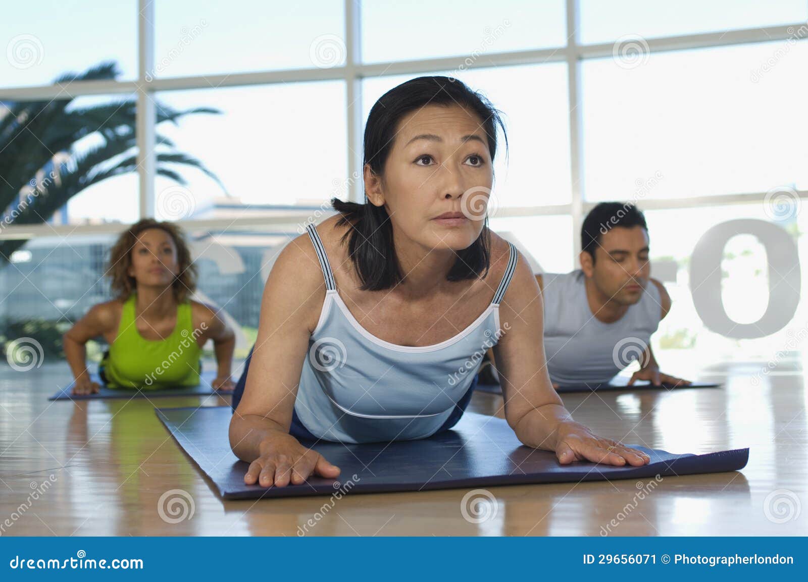 People Exercising on Mat stock image. Image of health - 29656071