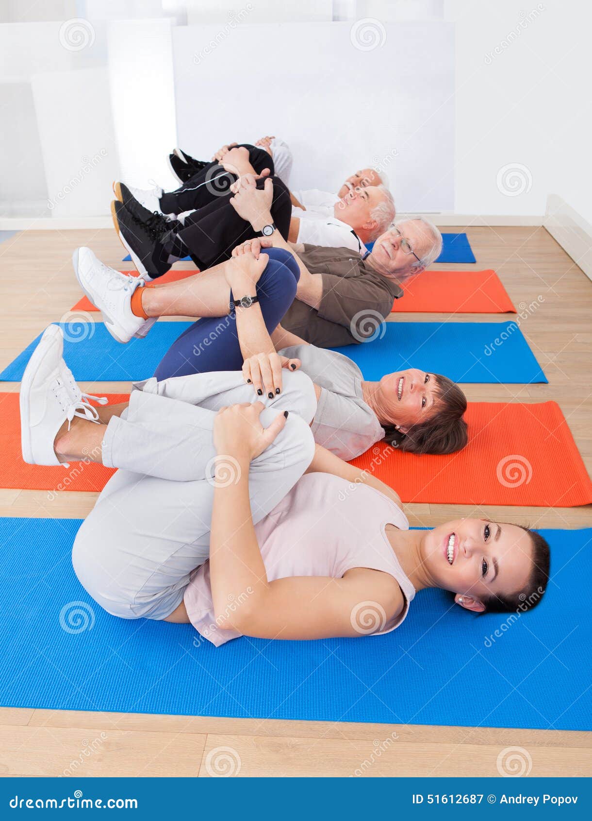 People Exercising on Mats at Gym Stock Image - Image of health ...