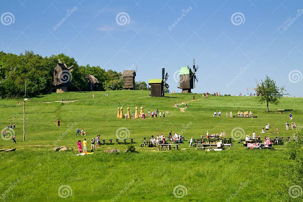 People at the Fair in a Field Stock Photo - Image of green, color: 27023562