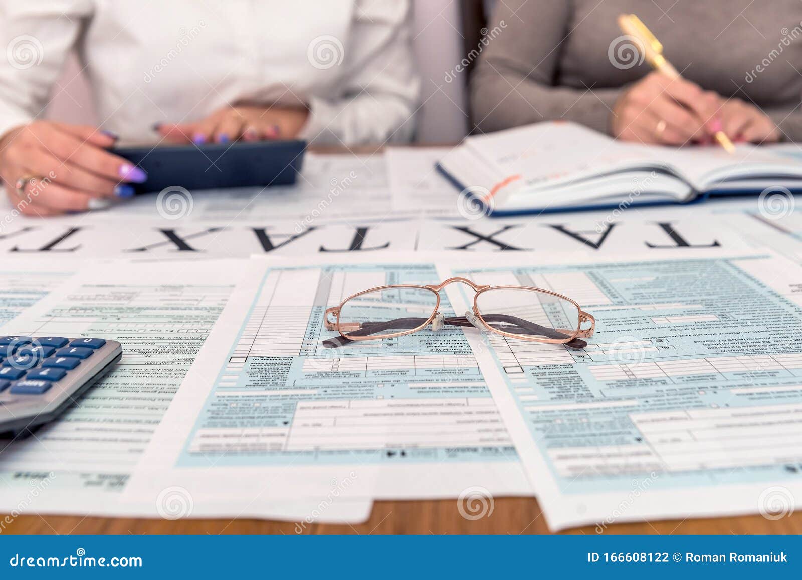 People Filling Visa Application Forms With Personal Passports At ...