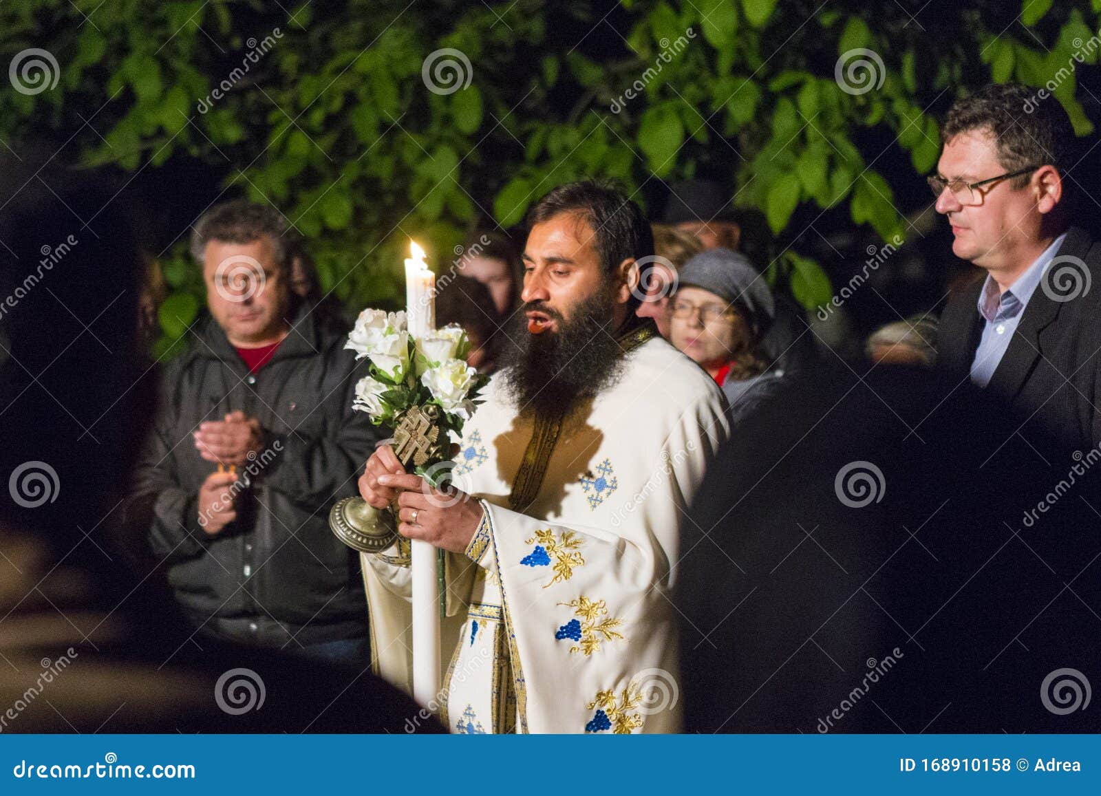 People Getting Light from the Priest in Easter Mass Stock Photo - Image ...