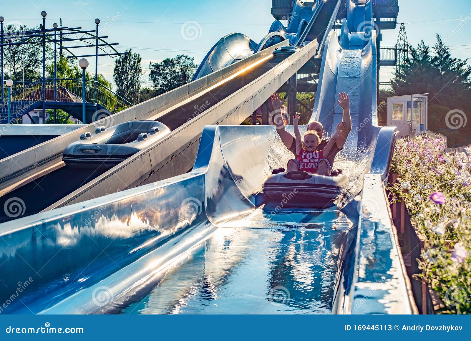 People Go Down on a Water Slide in a Leisure Park Stock Image - Image ...