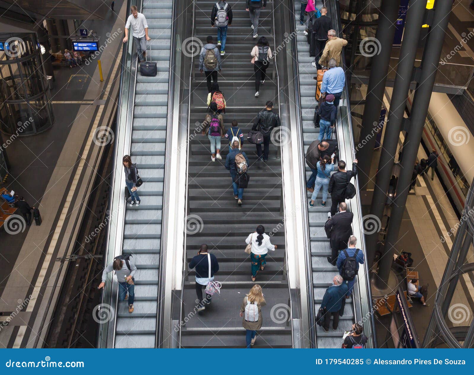 People Going Up and Down by the Escalator in the Main Train Station ...