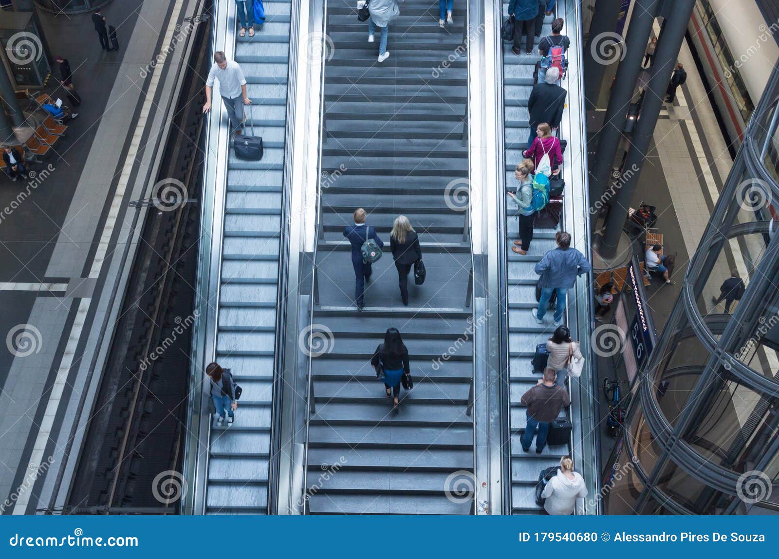 People Going Up and Down by the Escalator in the Main Train Station ...