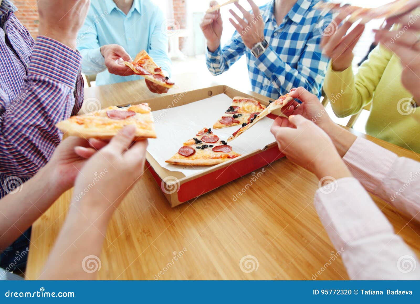 People grabbing pizza stock photo. Image of group, portion - 95772320