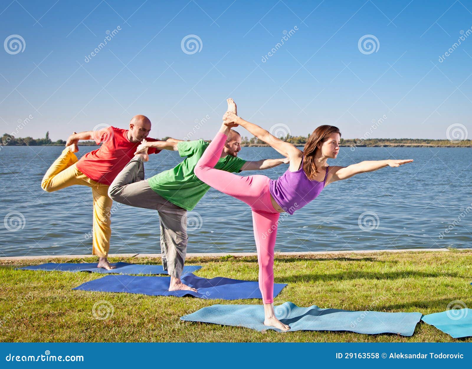 People in Group Practice Yoga Asana on Lakeside. Stock Photo - Image of ...