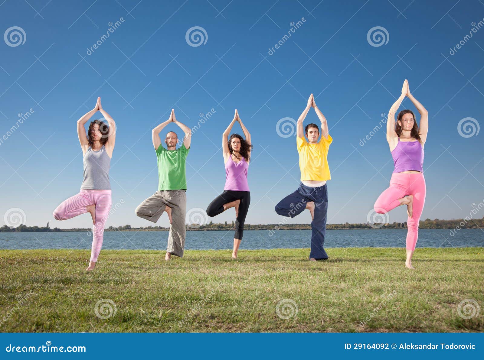People in Group Practice Yoga Asana on Lakeside. Stock Photo - Image of ...