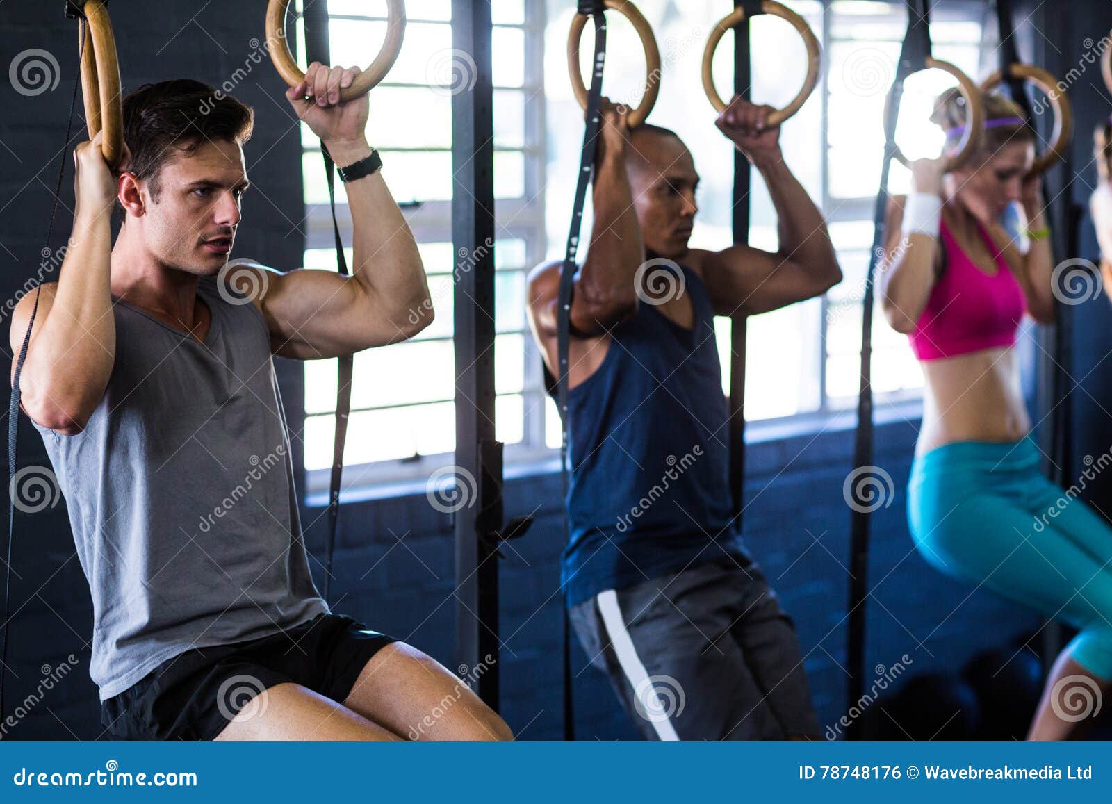 People Hanging from Gymnastic Rings in Gym Stock Photo - Image of male ...