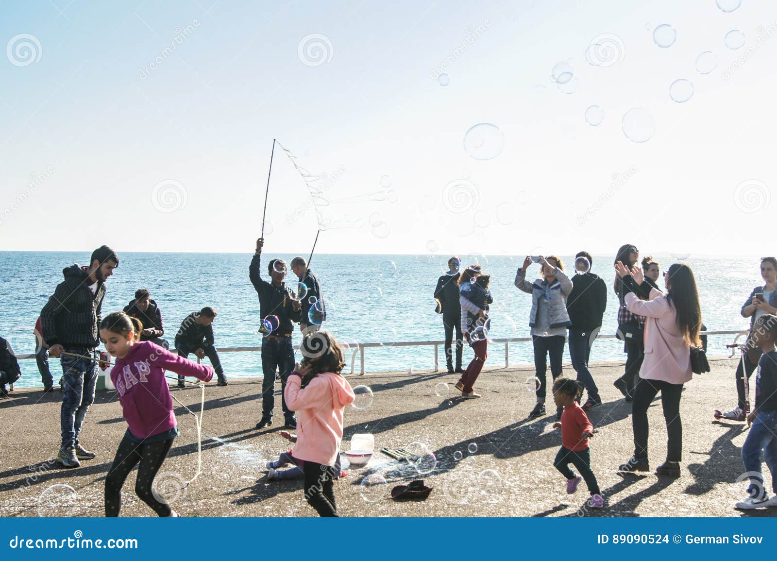 People Have Fun with Soap Bubbles. Editorial Stock Image - Image of ...