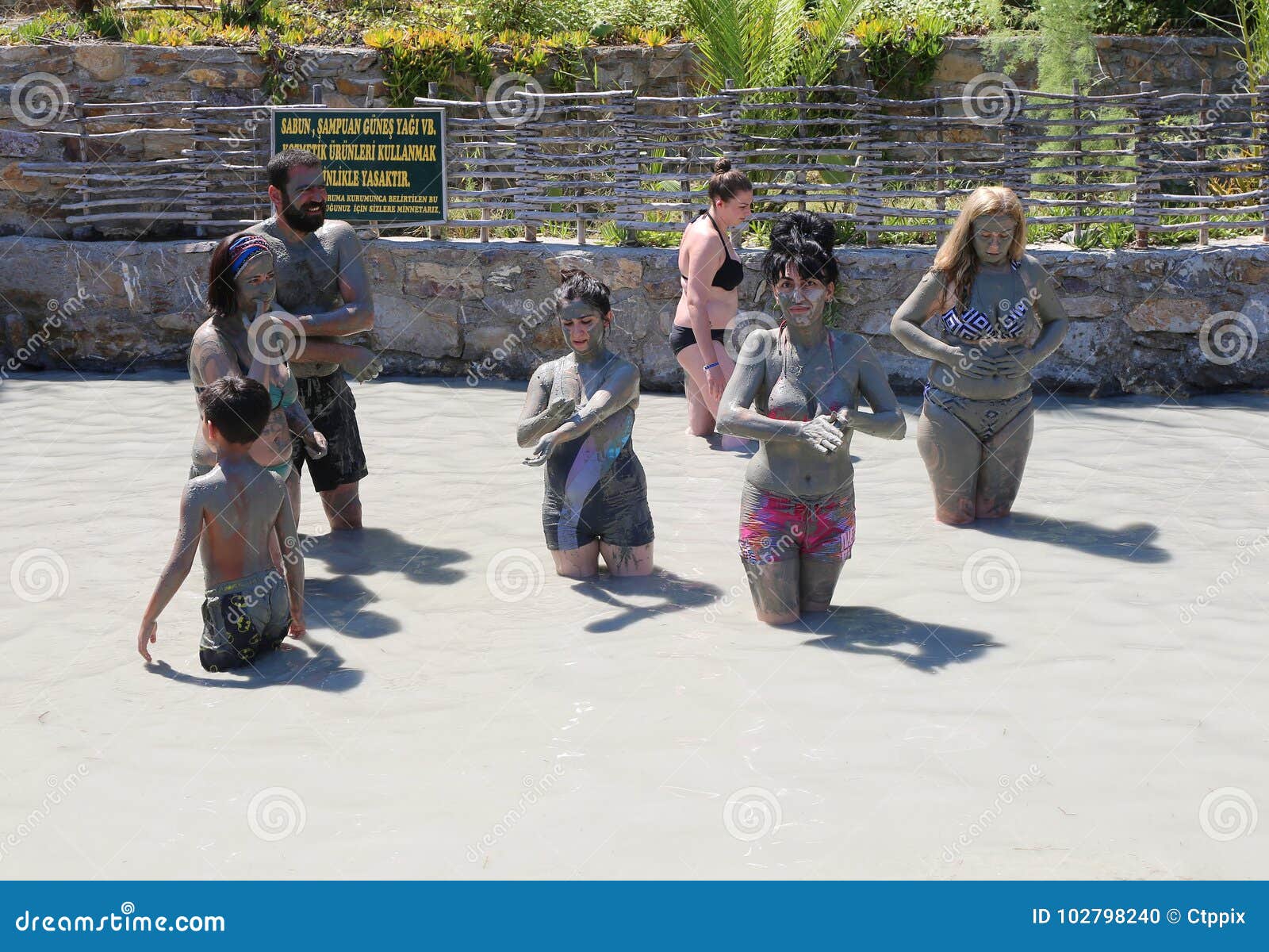 People having mud bath editorial image. Image of pose - 102798240