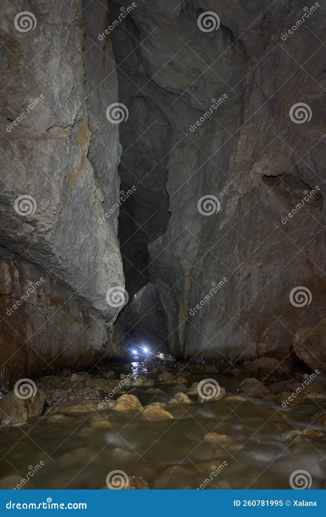 People with Headlamps Exploring a Cave Stock Image - Image of lamp ...