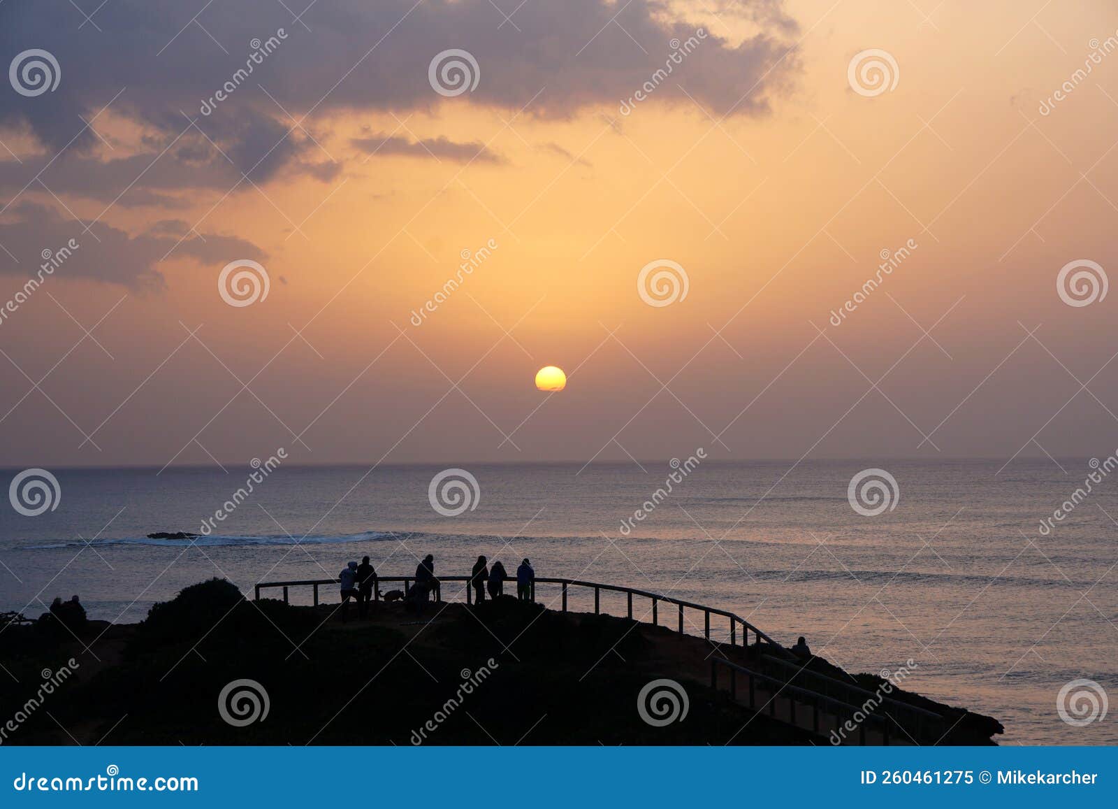 People on a Hill Watching the Sunset Over the Ocean Stock Image - Image ...
