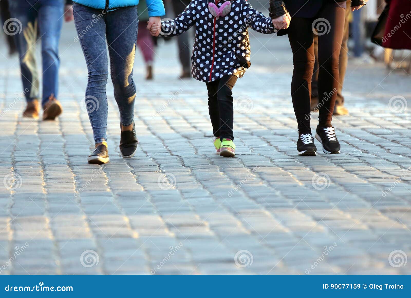 People Holding Hands Walking on the Pavement Stock Image - Image of ...