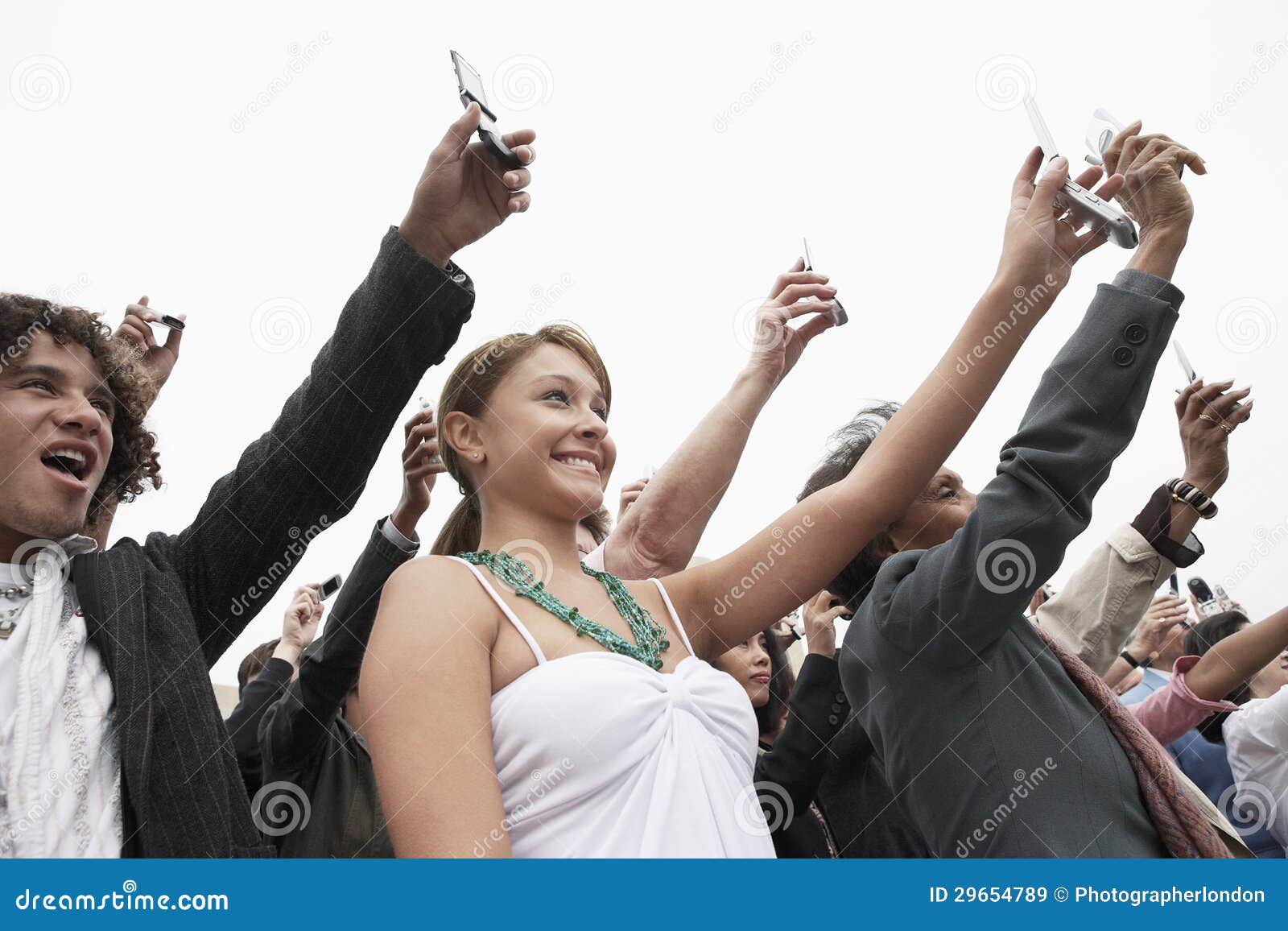 People Holding Mobile Phone Stock Image - Image of hispanic, raised ...
