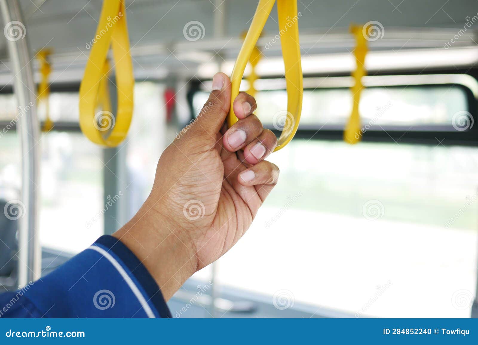 People Holding Onto a Handle on a Bus . Stock Photo - Image of painted ...