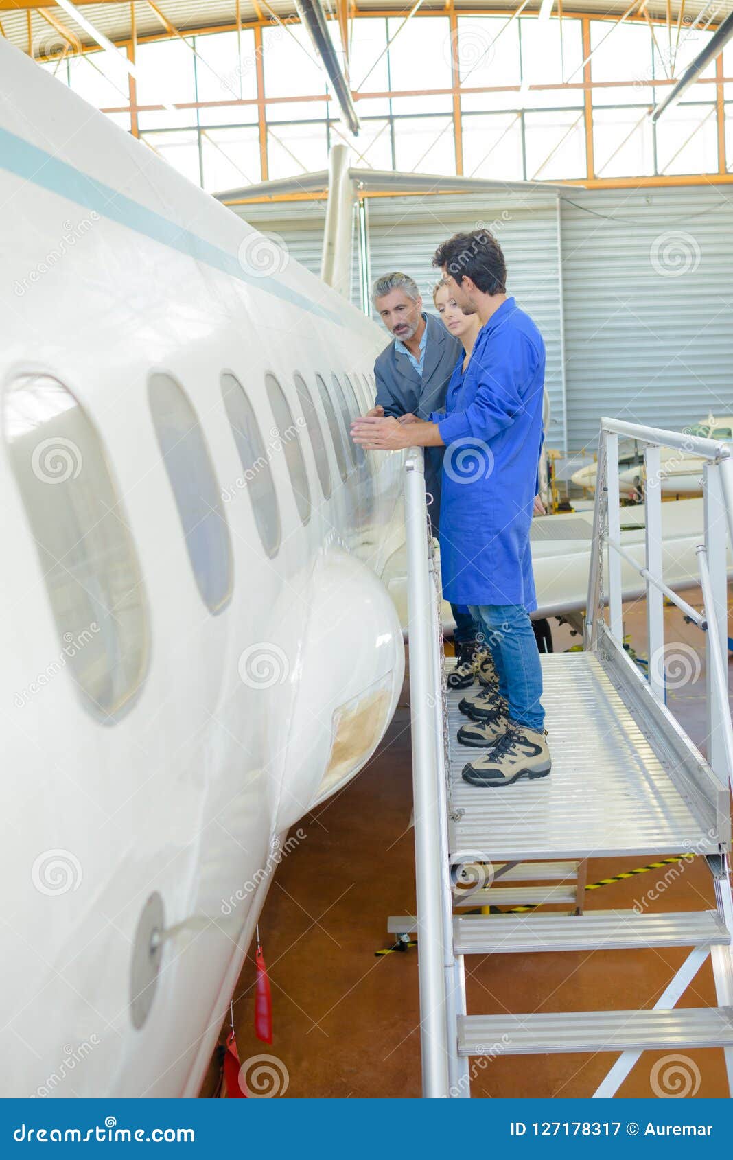 People Inspecting Aircraft Fuselage Stock Image - Image of engineer ...