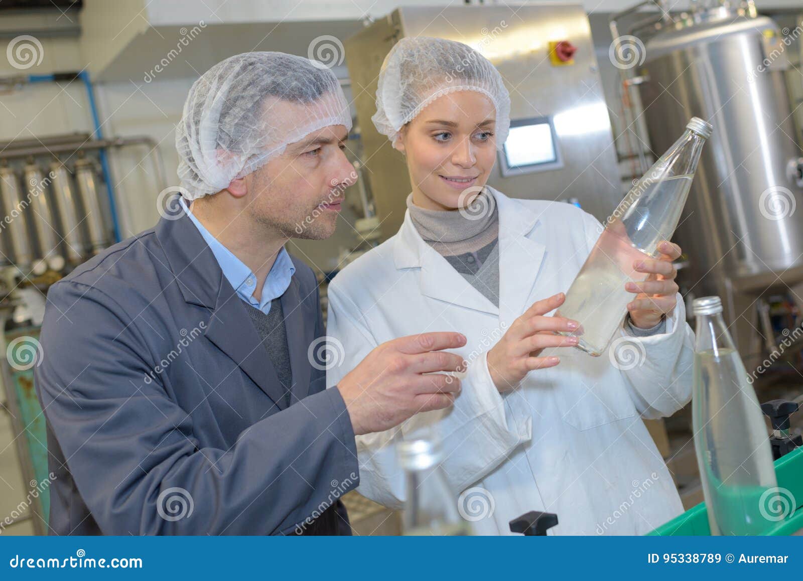 People Inspecting Bottle Water Going Down Production Line Stock Image ...