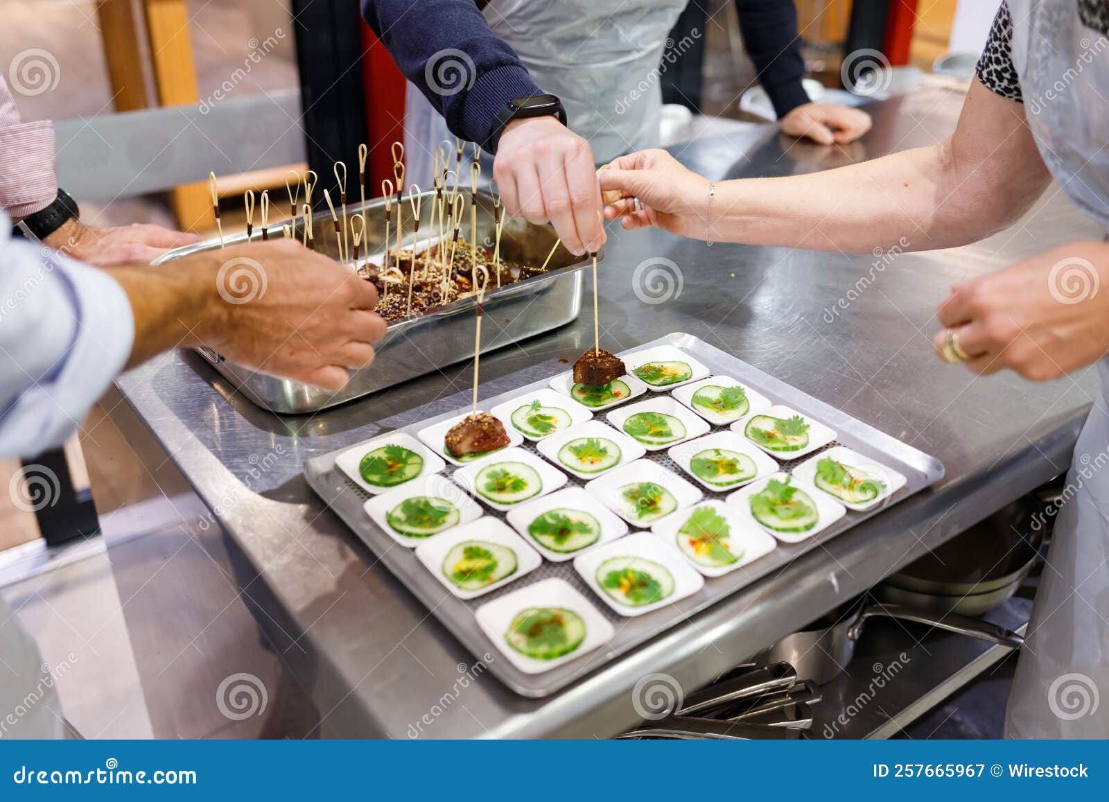 People are in the Kitchen Preparing Appetizers for a Buffet Meal Stock ...