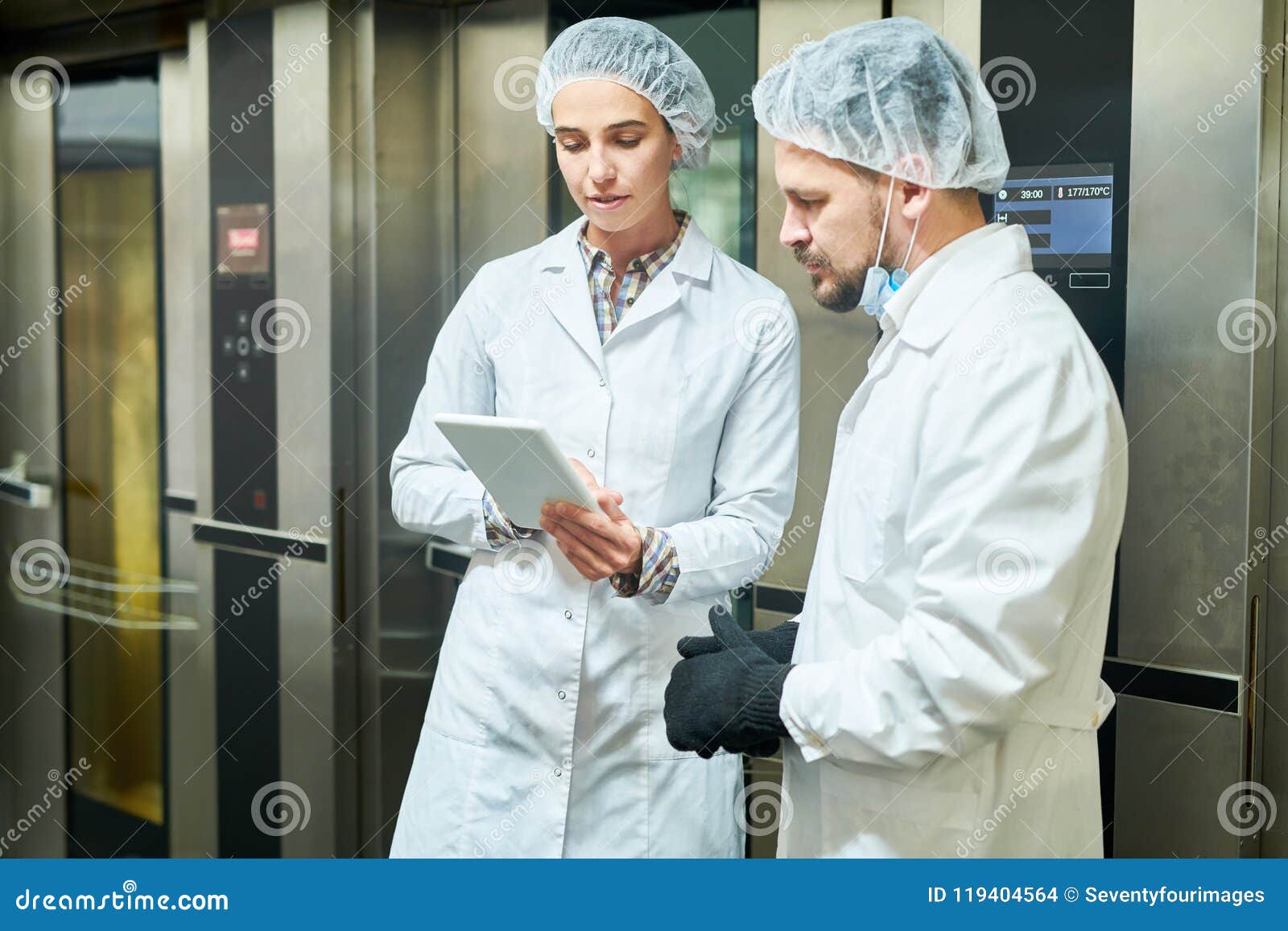 People in Lab Coats Standing and Using Tablet Stock Photo - Image of ...